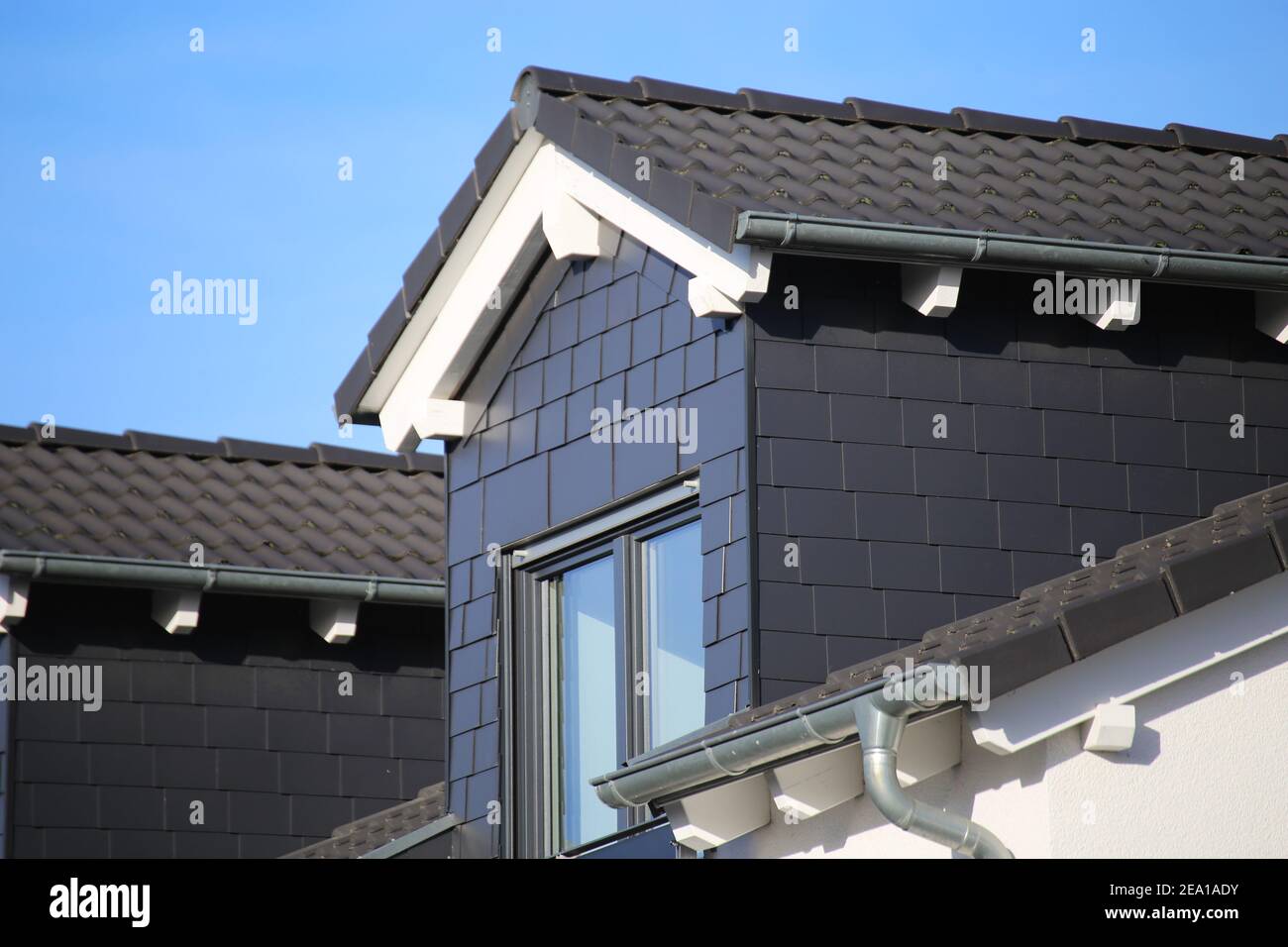Slate cladded dormer on a new tiled roof Stock Photo - Alamy