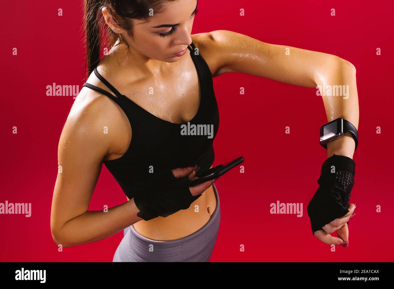 Woman runner with phone on arm hi-res stock photography and images - Alamy