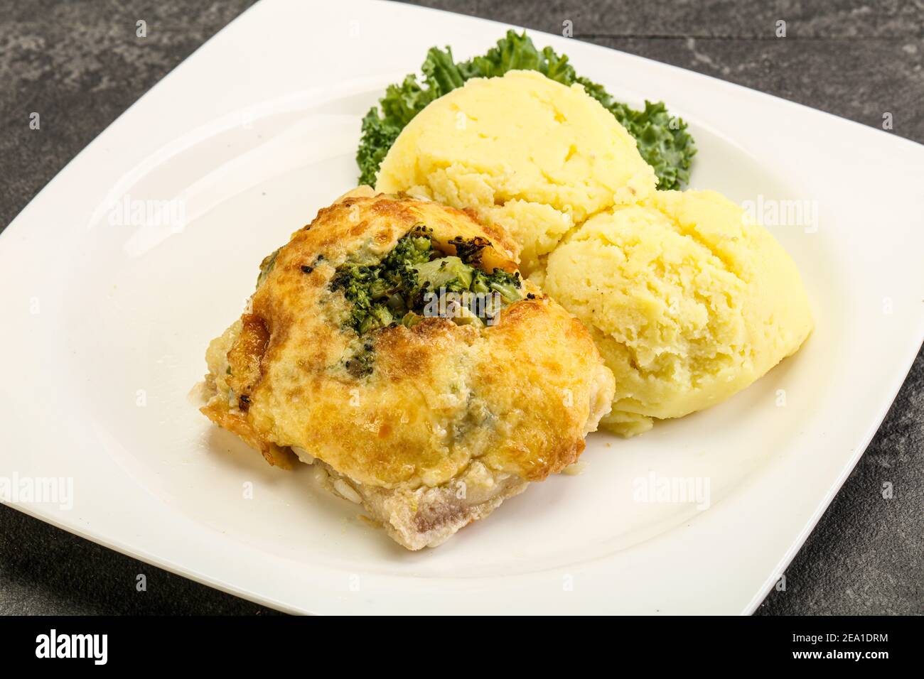 Roasted pangasius fillet with mashed potato and cheese Stock Photo - Alamy