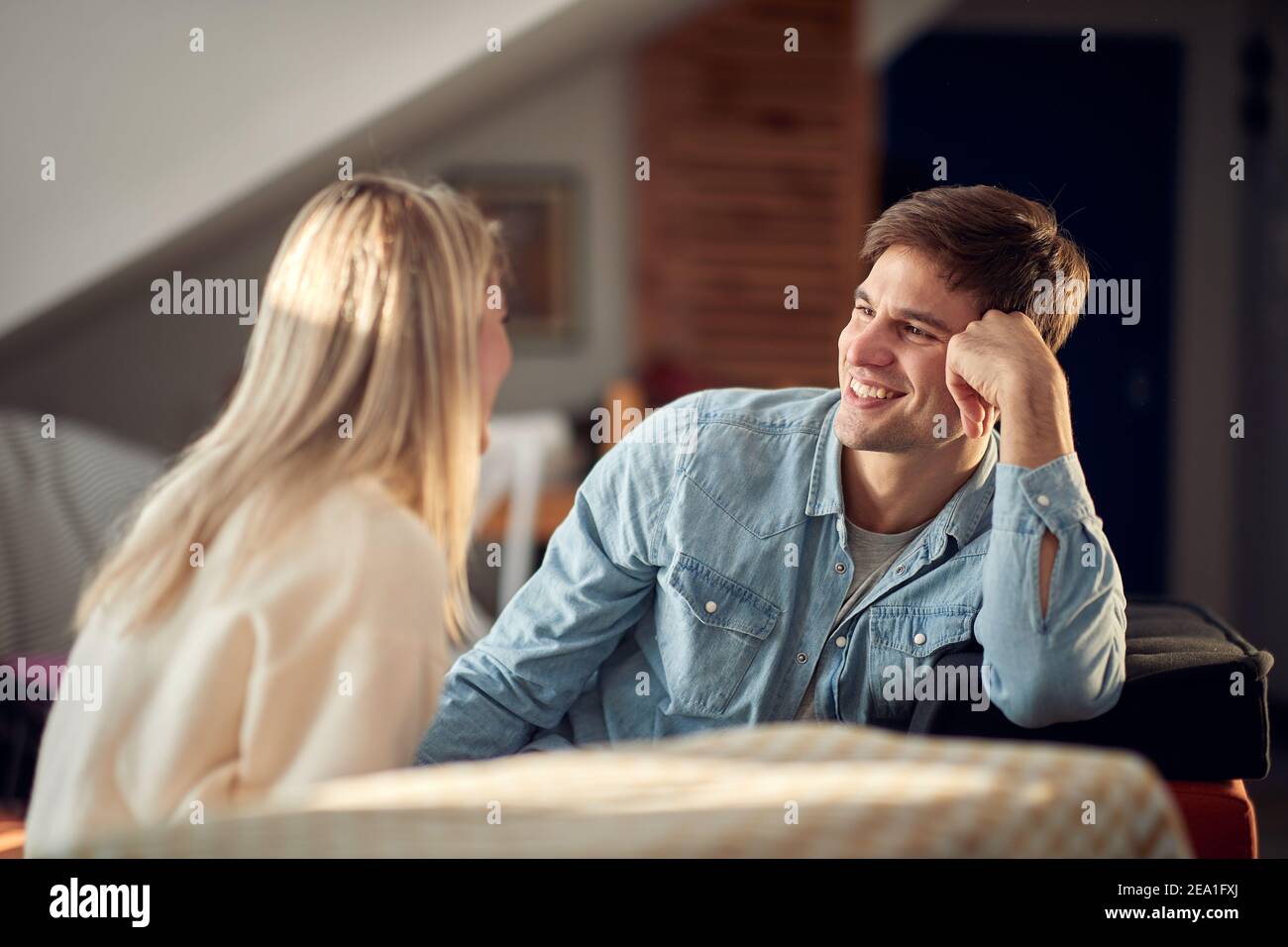 A young couple in romantic moments in a relaxed atmosphere at home ...