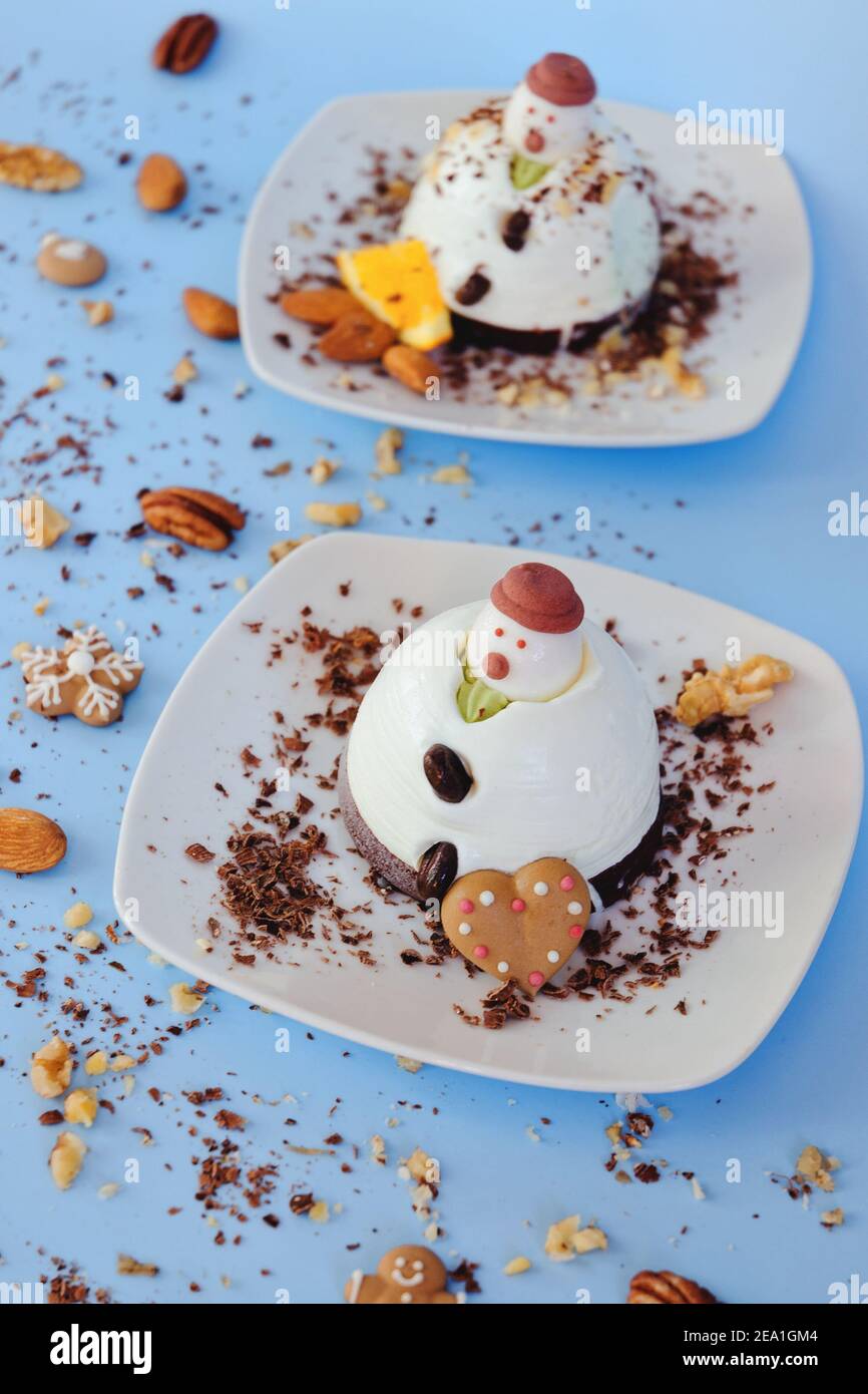 Ice cream background in the shape of two edible snowmen on white plates ... Ice cream background in the shape of two edible snowmen on white plates ...