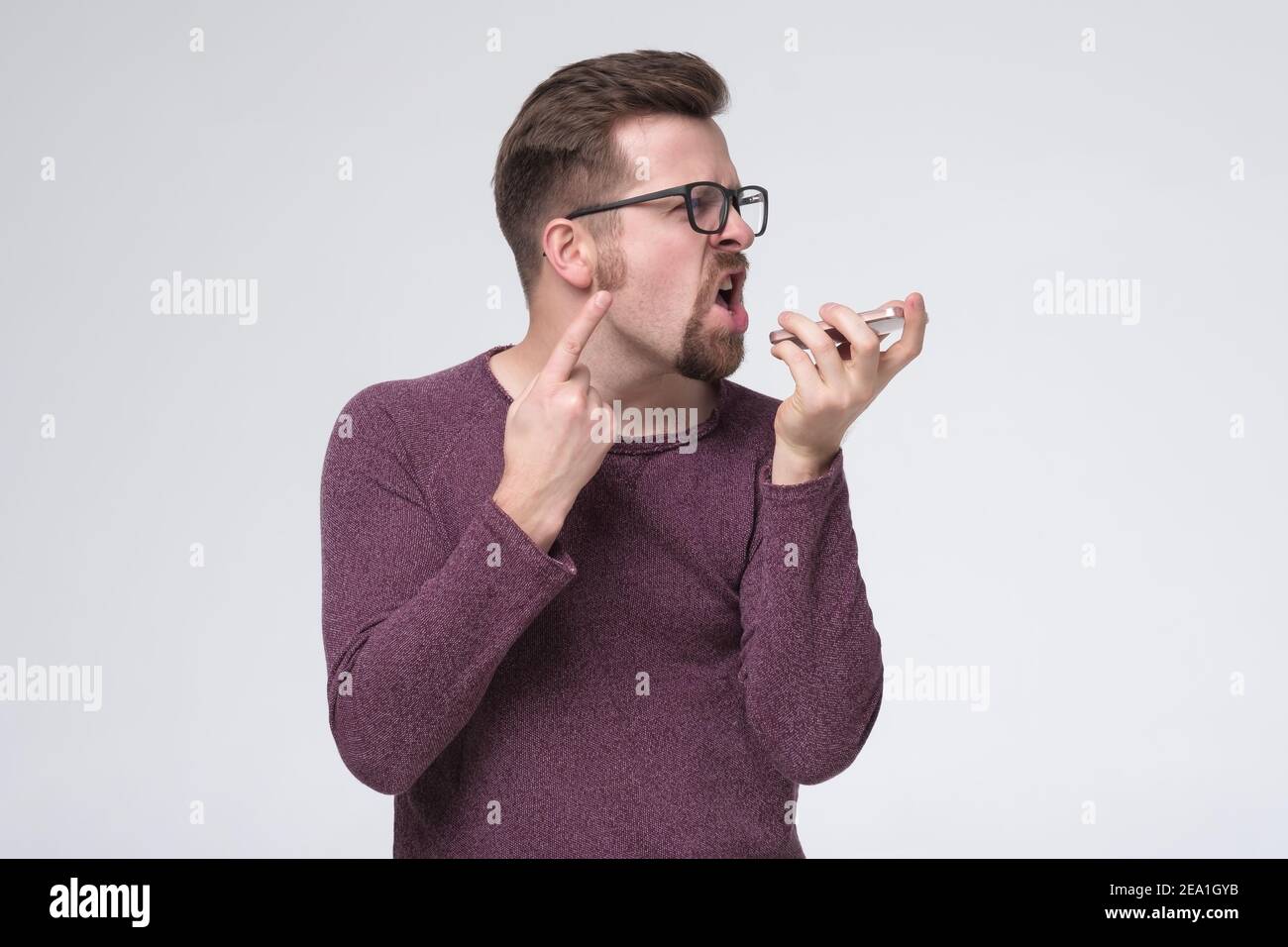 Nervous man arguing mobile phone hi-res stock photography and images ...