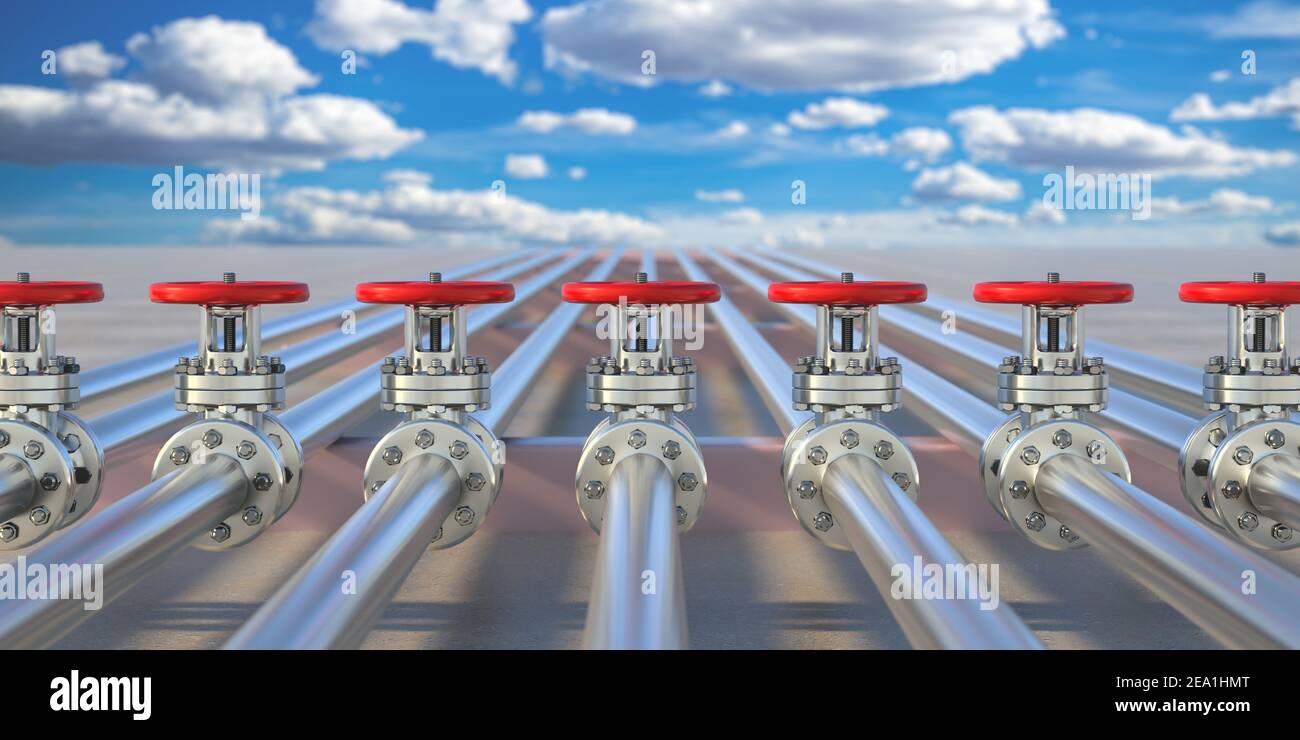 Row of industrial pipelines and valves with red wheels on blue sky ...
