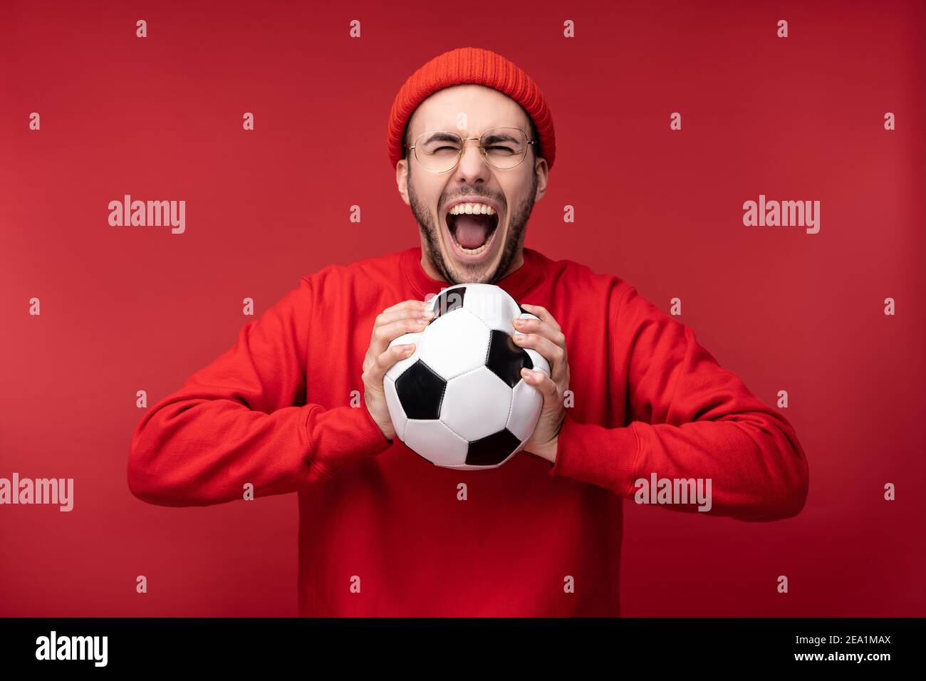 Photo of attractive man with beard in glasses and red clothing. Happy ...