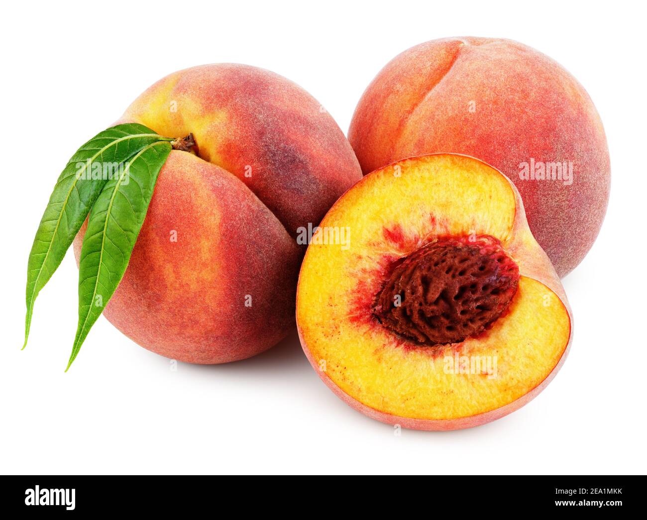 Group of peaches with half and green leaves isolated on white ...