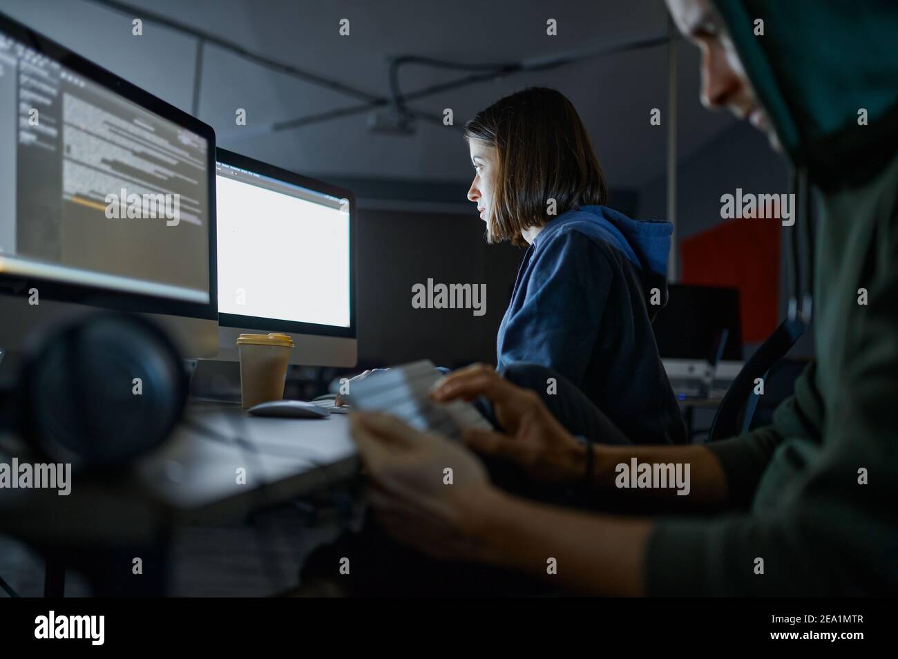 Male and female hackers works in darknet Stock Photo - Alamy