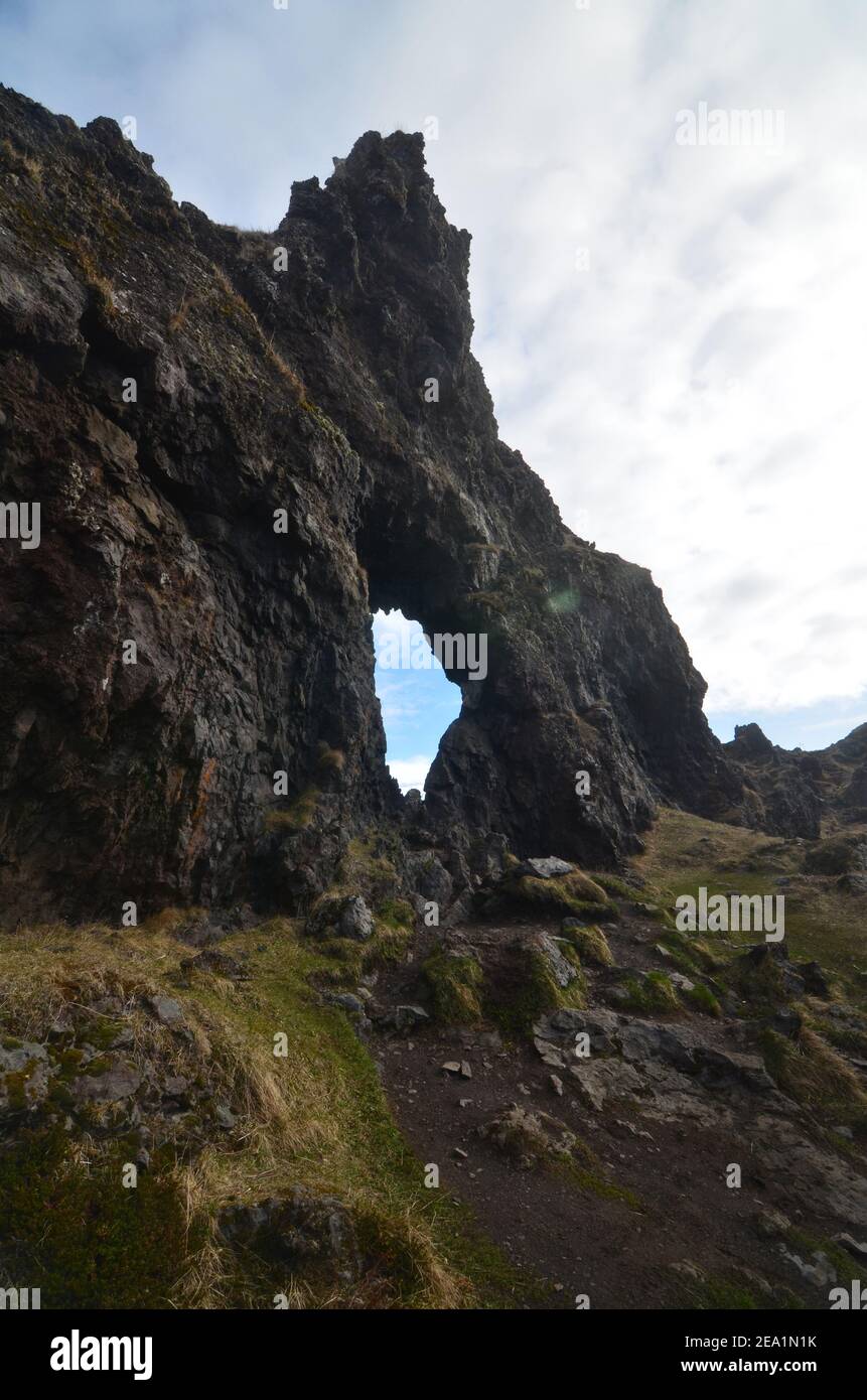 Beautiful view of an archway rock formation in Iceland Stock Photo - Alamy