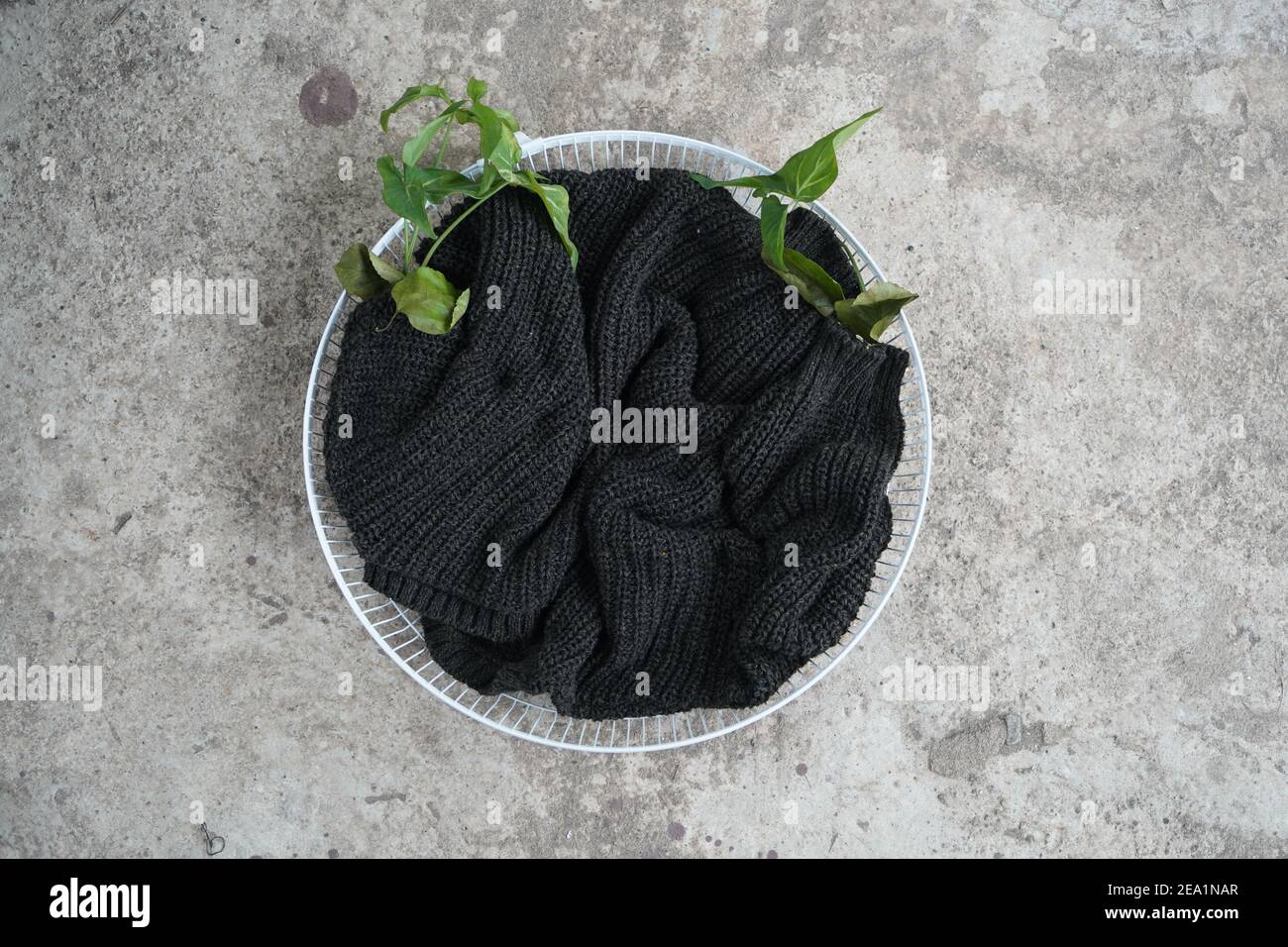 A top view of a black sweater in an embroidery hoop Stock Photo - Alamy