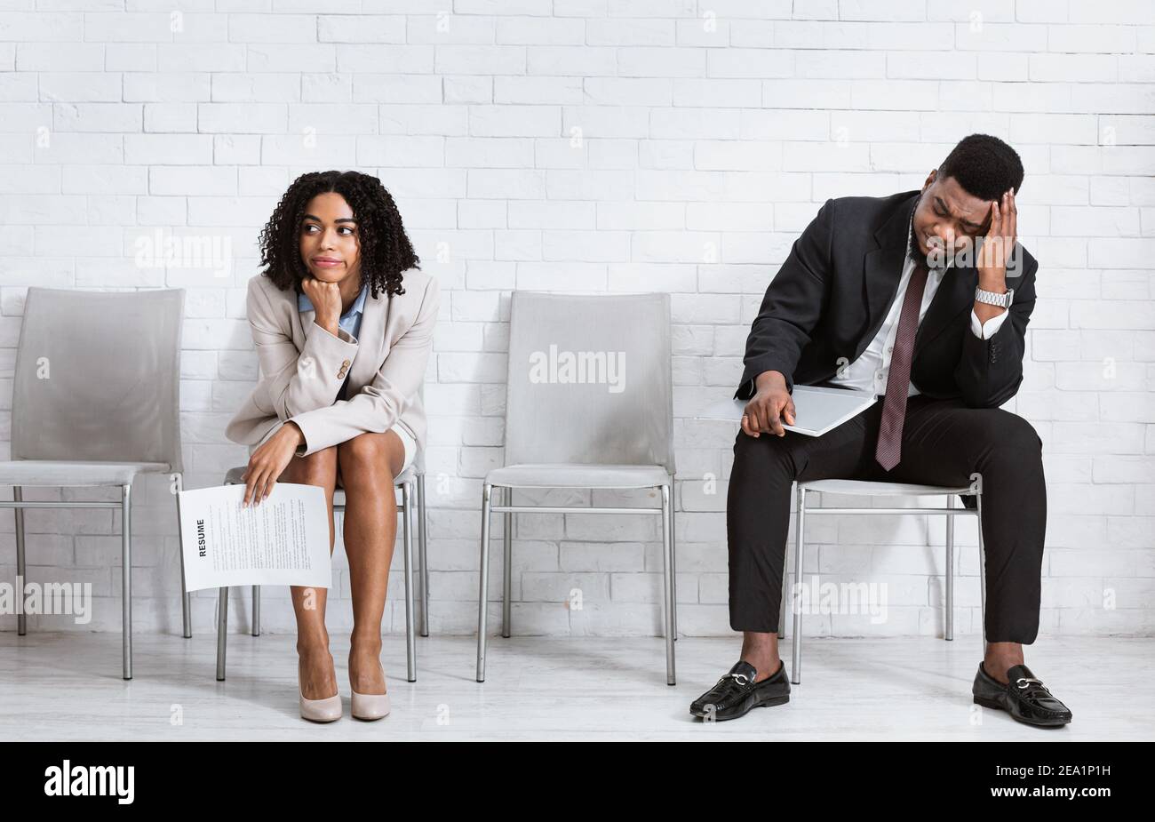 African American man and woman feeling exhausted from waiting for job ...