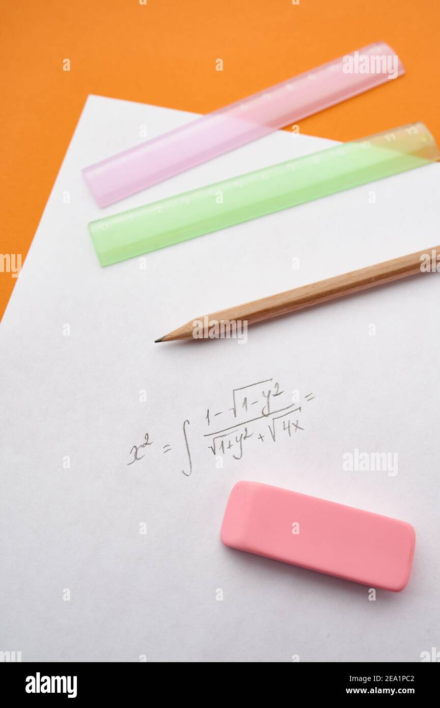Pencil, ruler and rubber, paper sheet, stationery Stock Photo - Alamy