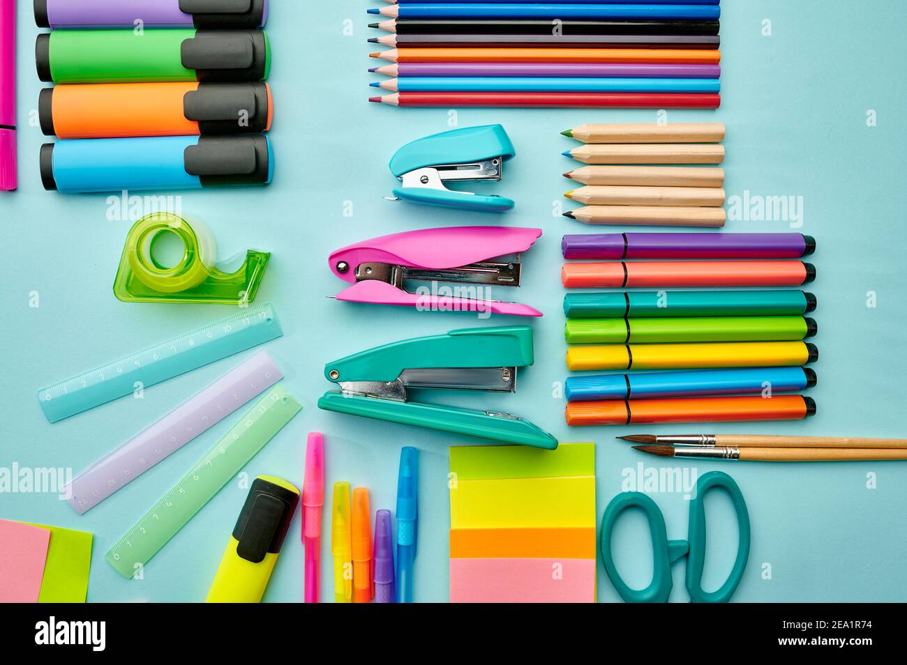 Office stationery supplies, blue background Stock Photo - Alamy