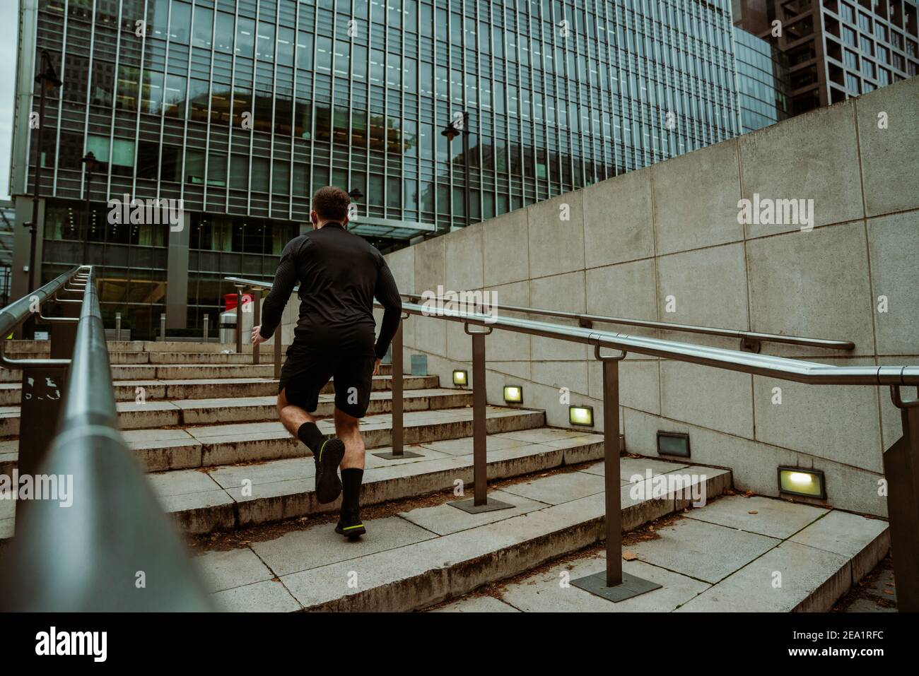 Man running up bridge stairs hi-res stock photography and images - Alamy