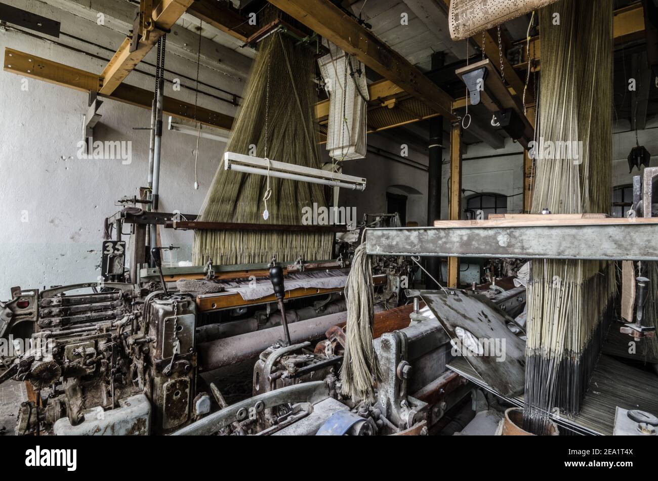 machines with yarn and fabric in spinning Stock Photo - Alamy