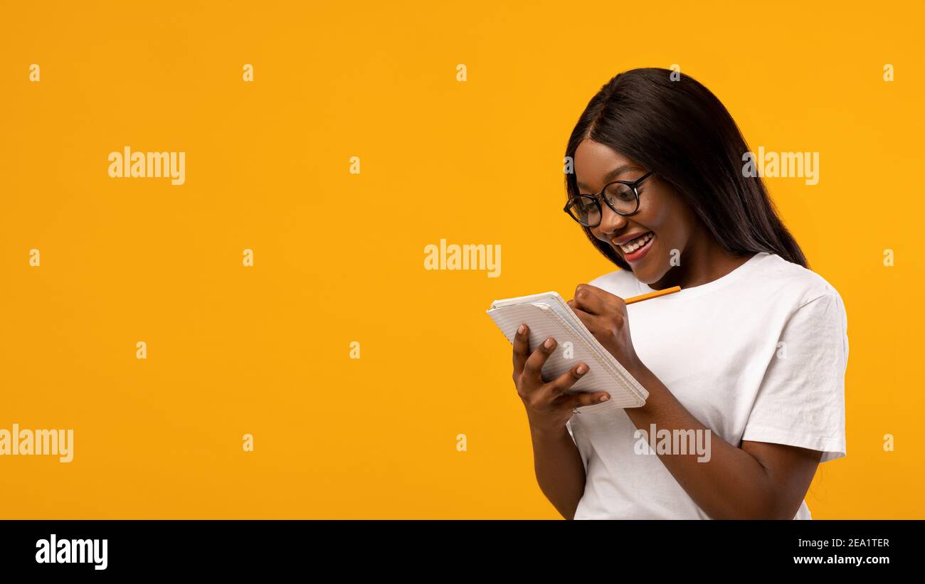 Young woman writing plans hi-res stock photography and images - Alamy