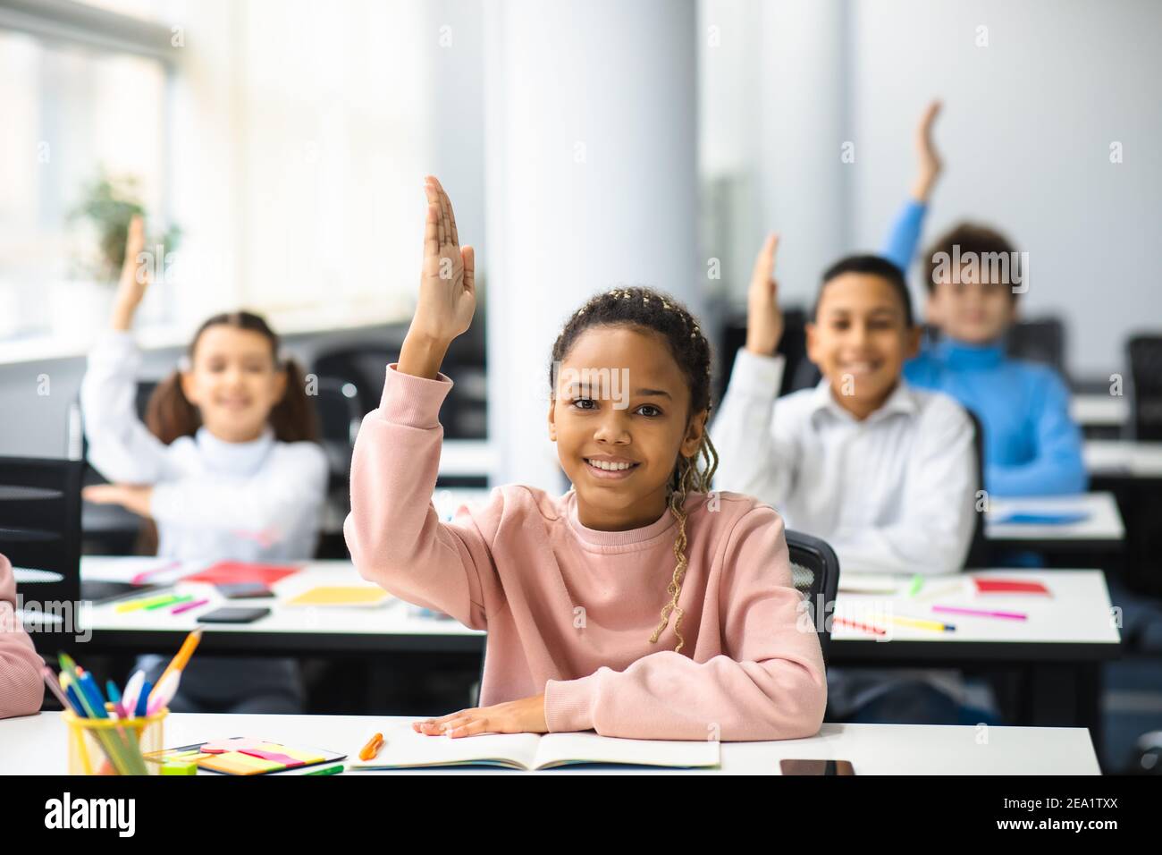 Children raising hand classroom hi-res stock photography and images - Alamy