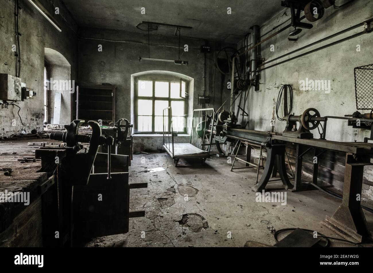 locksmith with workbench in abandoned factory Stock Photo - Alamy