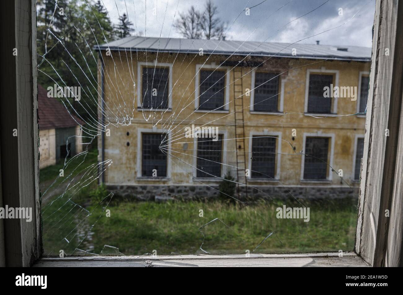 view through broken busted window Stock Photo - Alamy