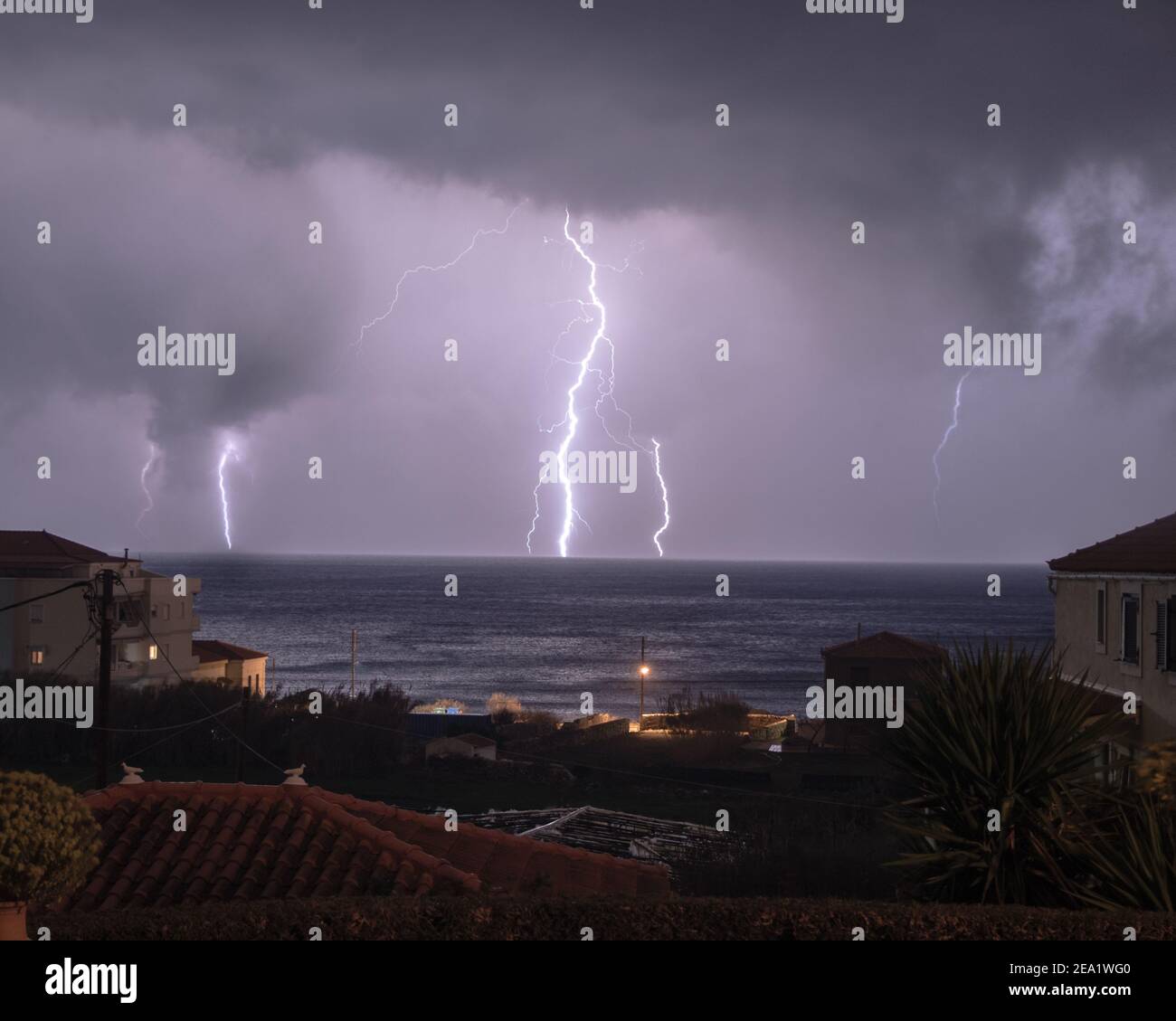 lightning hits the water off the coast Stock Photo - Alamy
