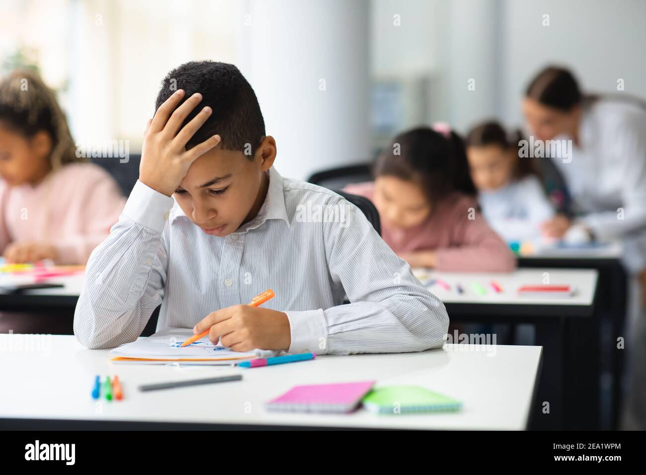 Sad child classroom hi-res stock photography and images - Alamy
