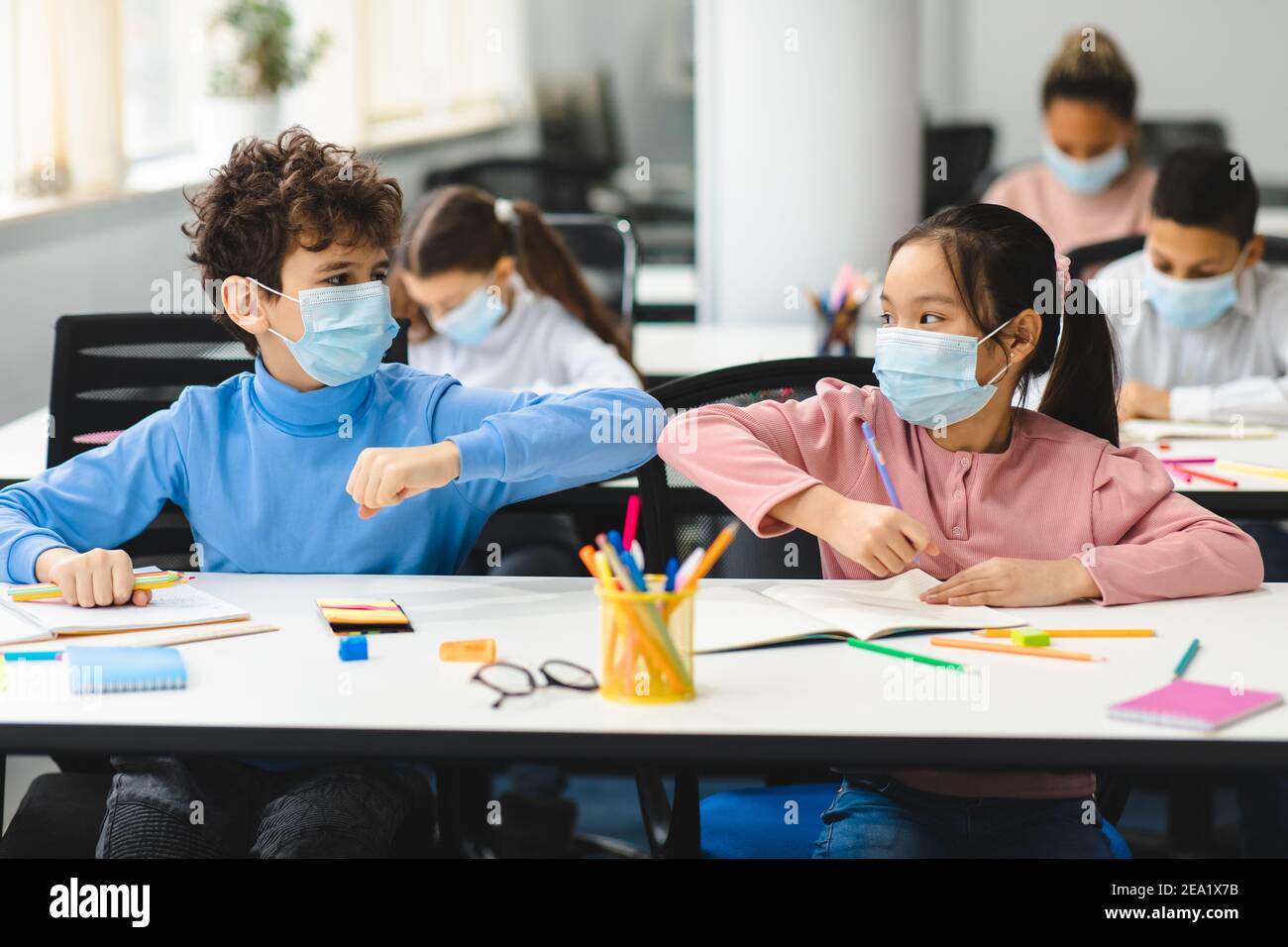 Student bumping elbows hi-res stock photography and images - Alamy