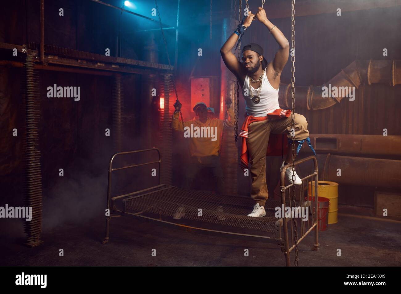 Two rappers posing, performing in cool studio Stock Photo - Alamy