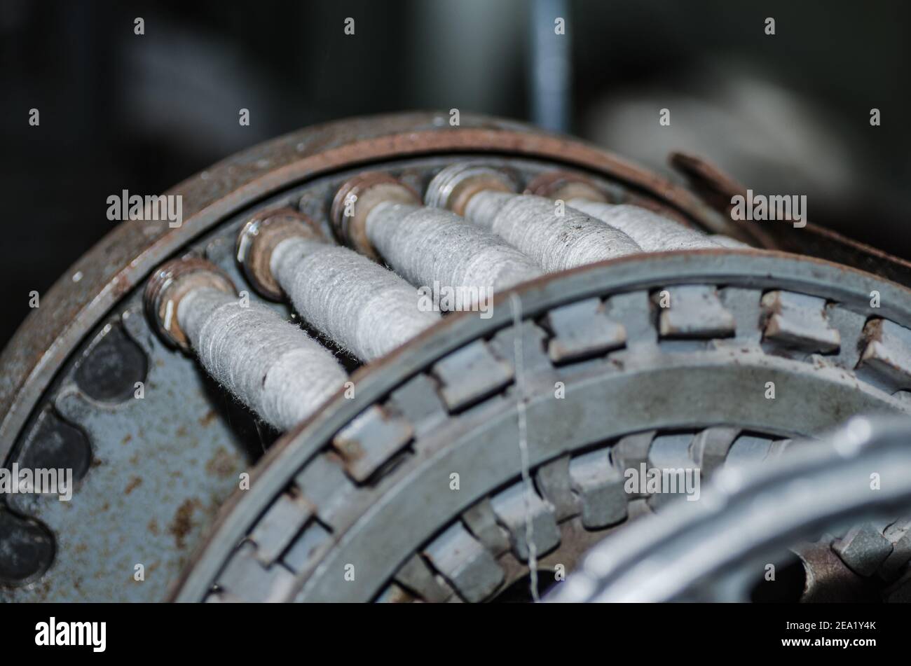 many spindles on old machine Stock Photo - Alamy