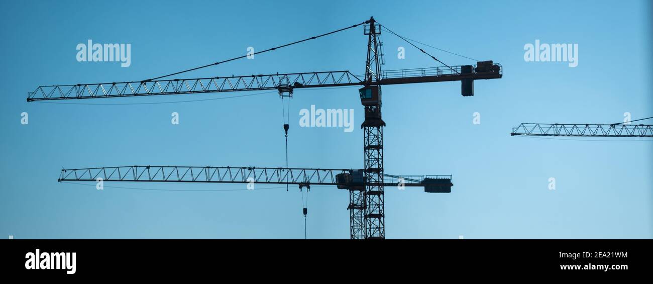 The Tower Crane against a blue sky Stock Photo - Alamy