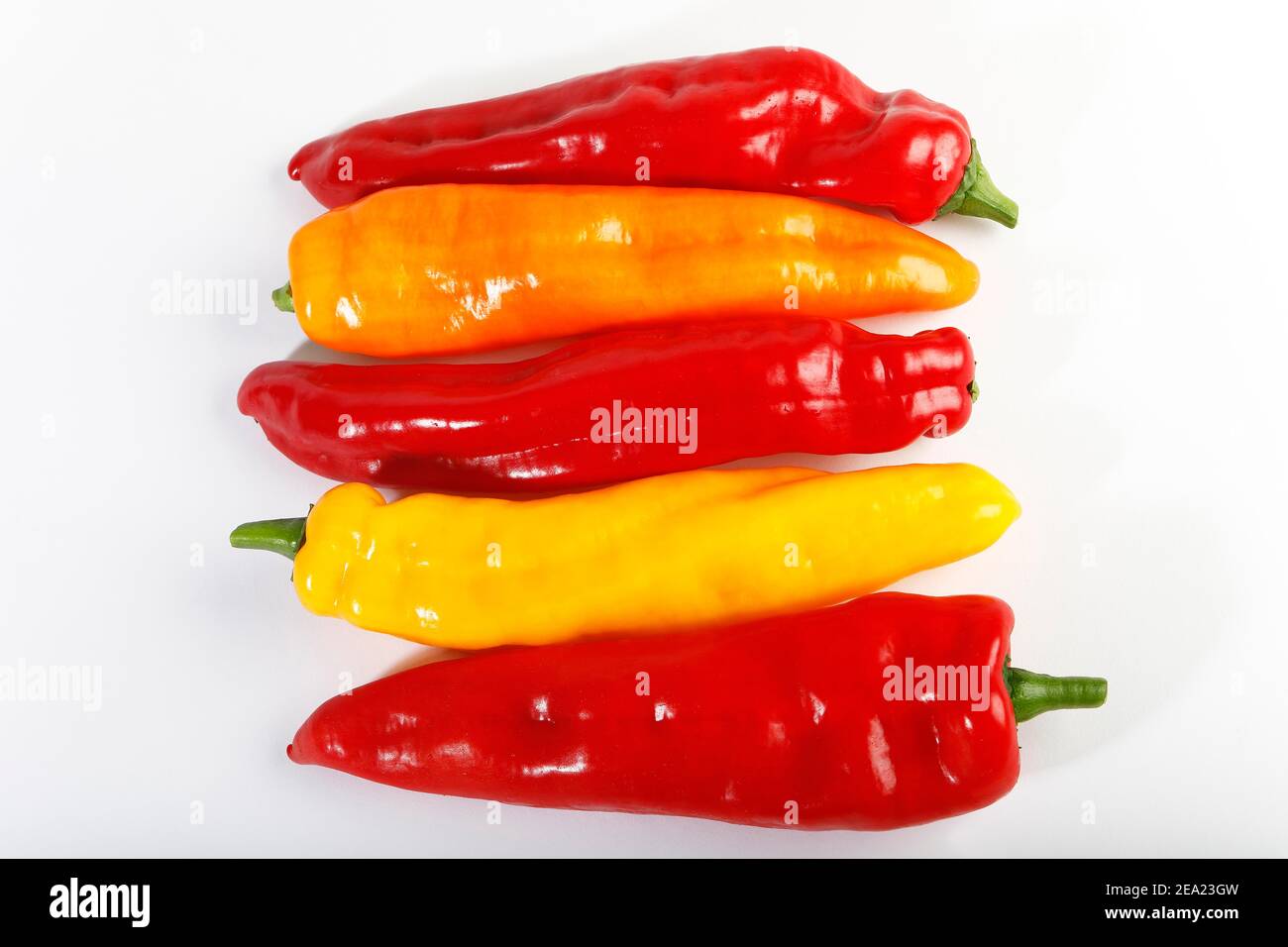 Red, yellow and orange pointed peppers (Capsicum annuum), vegetables ...