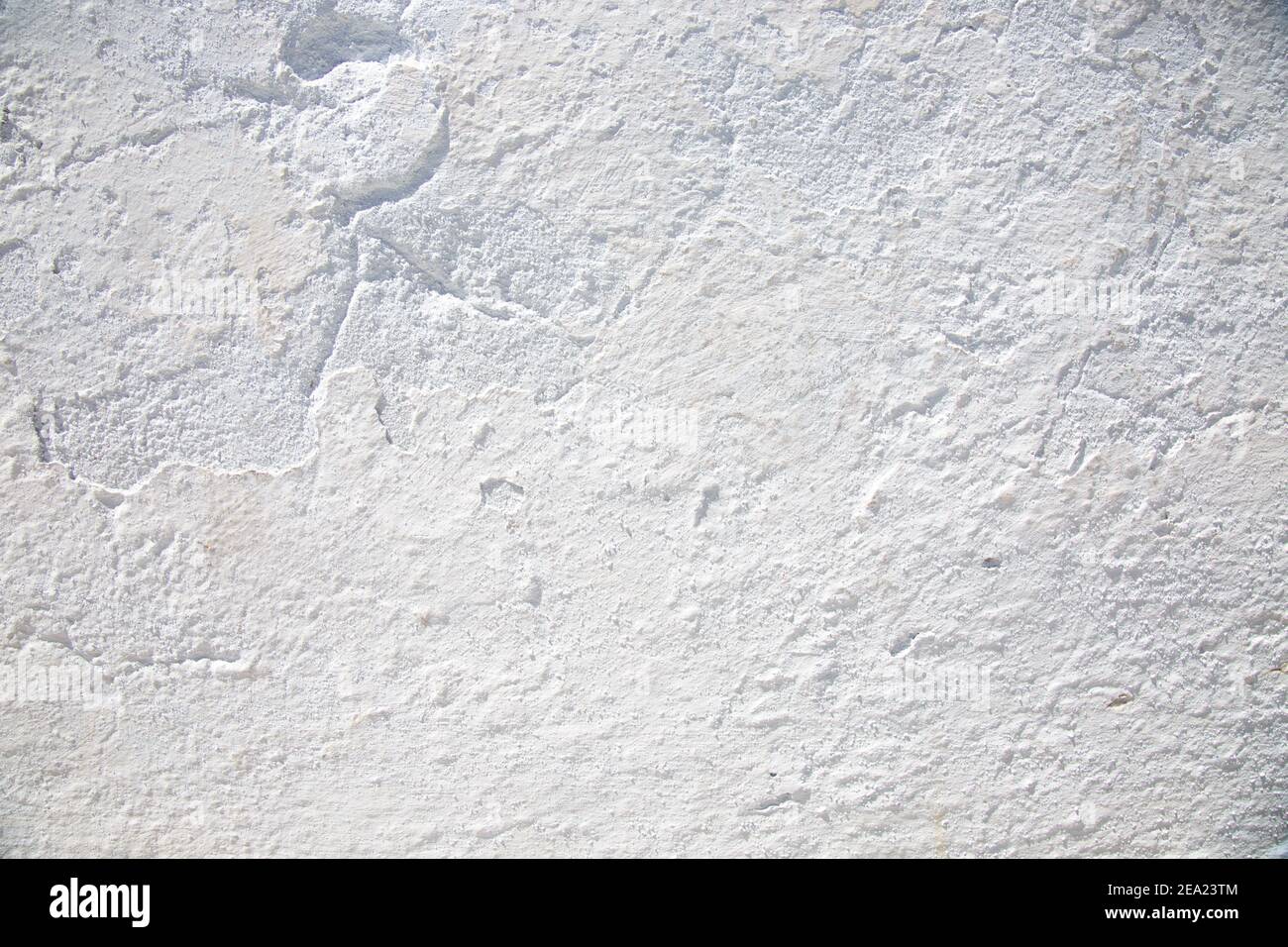 Close-up texture of white stone old wall. Wall covered with lime. The ...