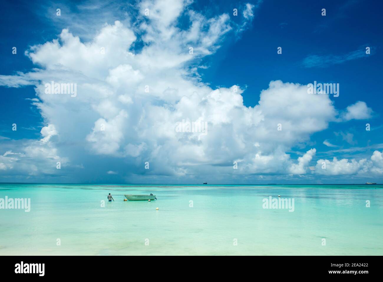 Little motorboat in the turquoise waters of the beautiful lagoon of ...