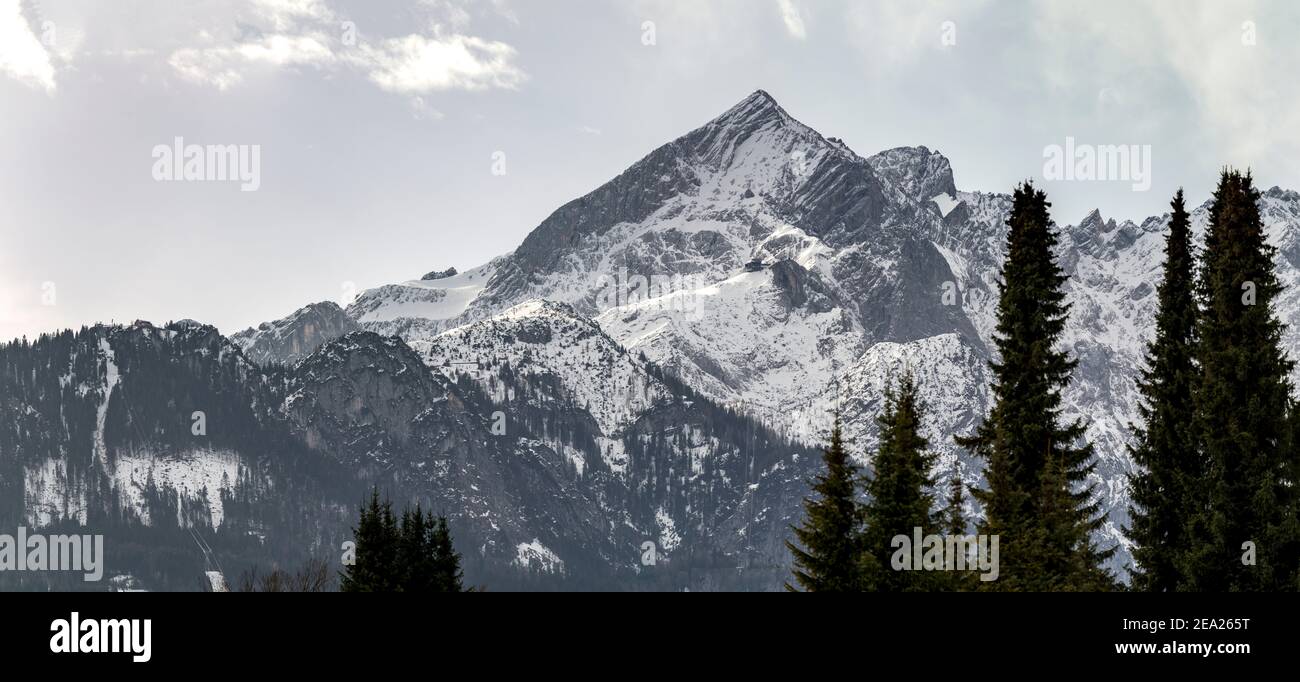 snow covered Alpspitze mountain in sidelight Stock Photo - Alamy