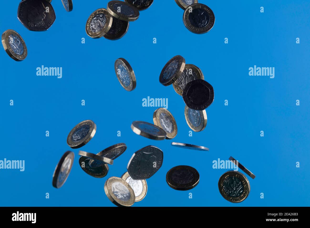 UK coins captured in mid air, falling down Stock Photo - Alamy