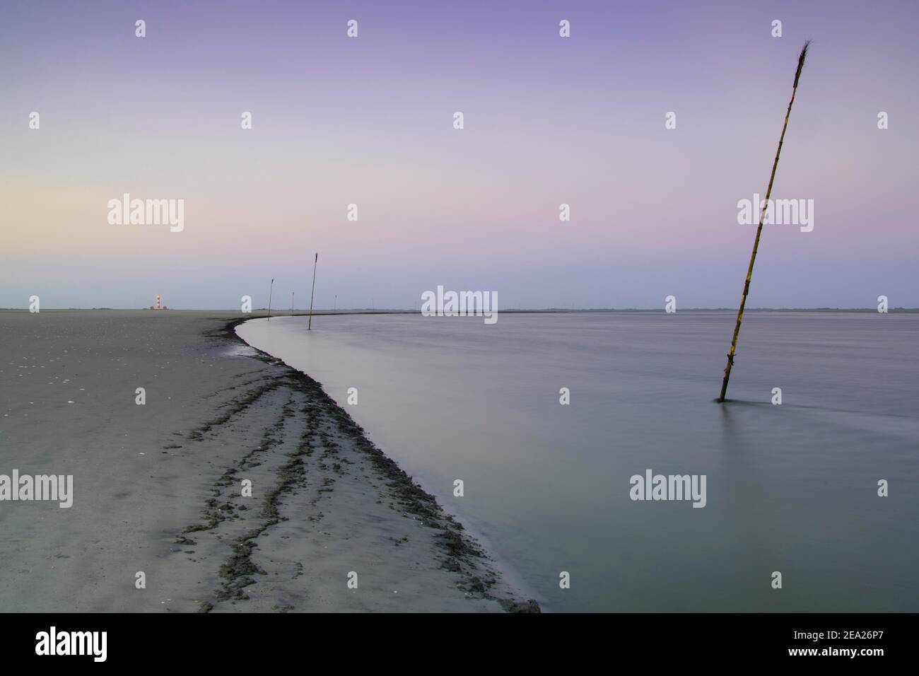 Sand beach in the mudflats after sunset, Wadden Sea National Park ...