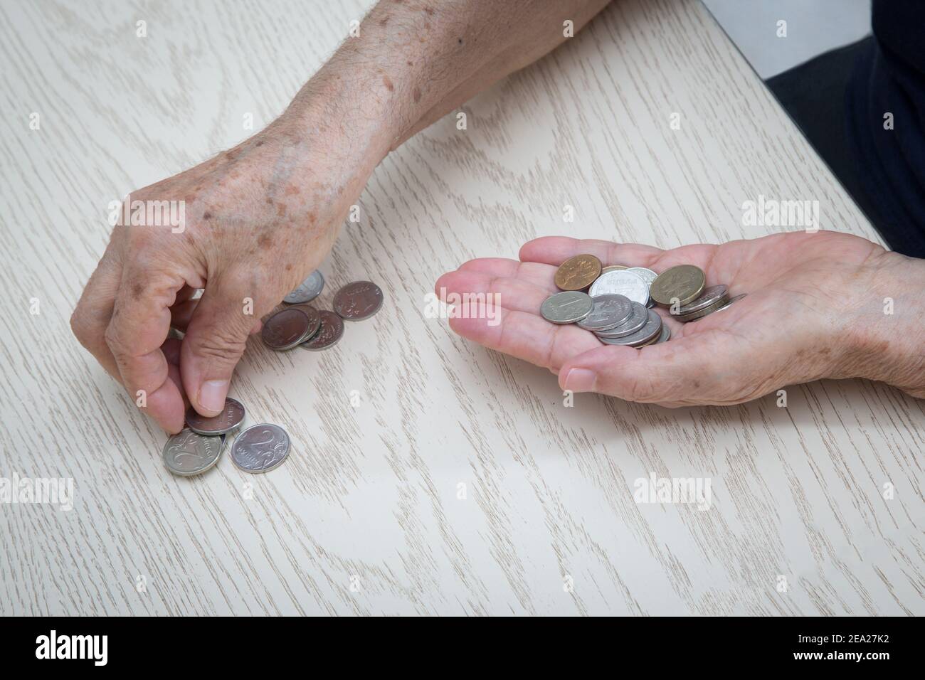 Old person counting coins hi-res stock photography and images - Alamy