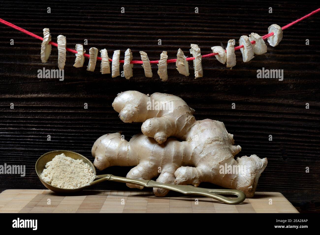 Ginger Tuber (Zingiber officinale) powder and discs hung up to dry ...