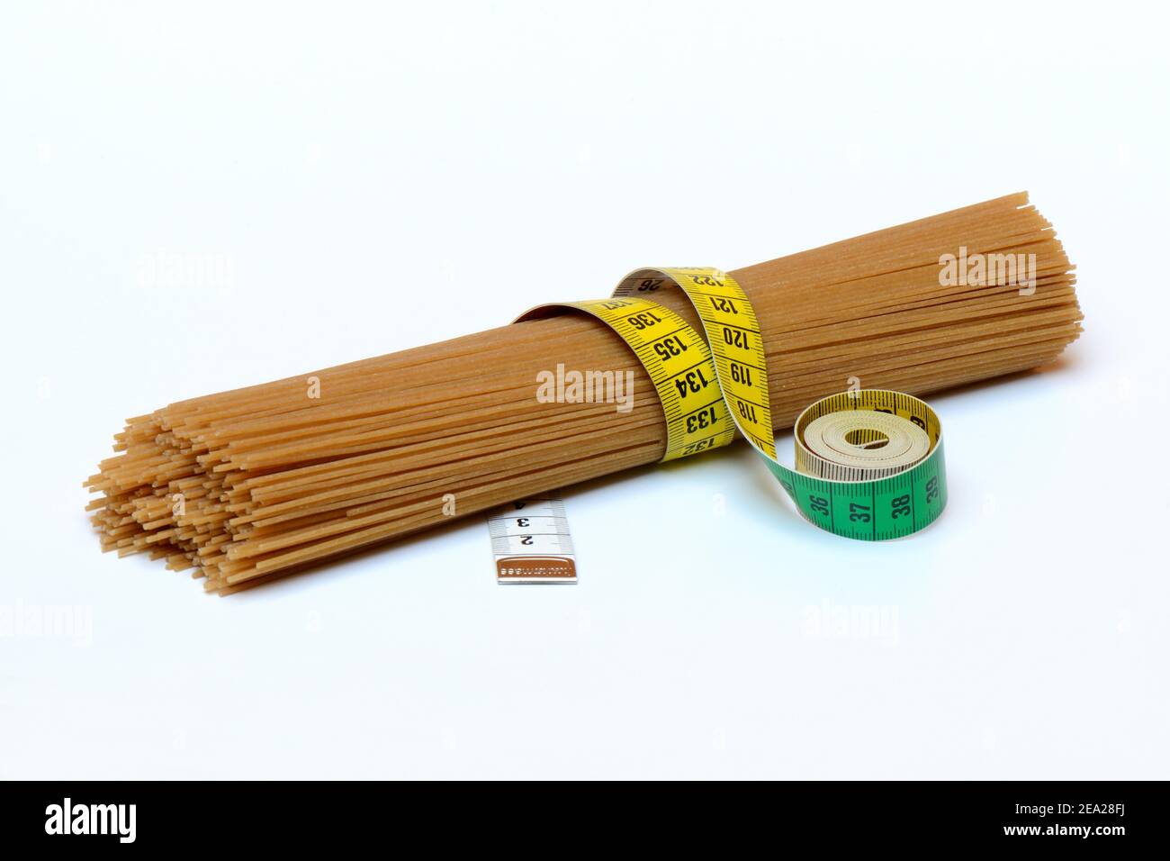 Spaghettis with measuring tape, wholemeal spaghetti Stock Photo - Alamy