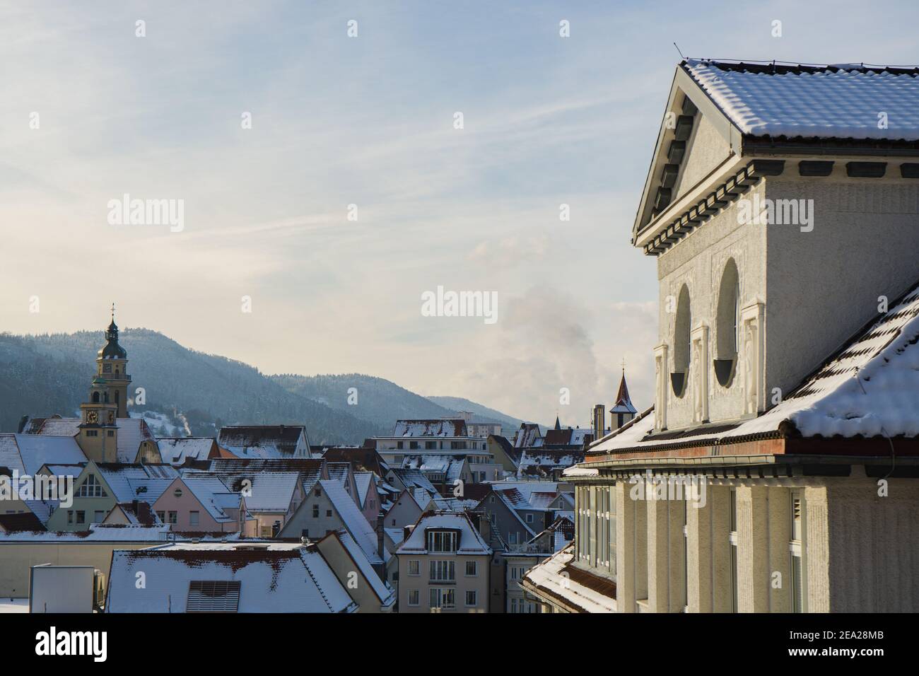 The beautiful snow-covered buildings under a cloudy sky Stock Photo - Alamy