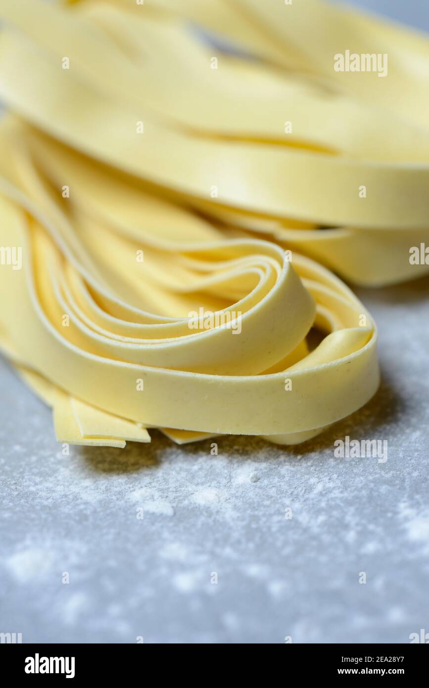 Tagliatelle, uncooked, pappardelle, pasta, ribbon noodles Stock Photo ...