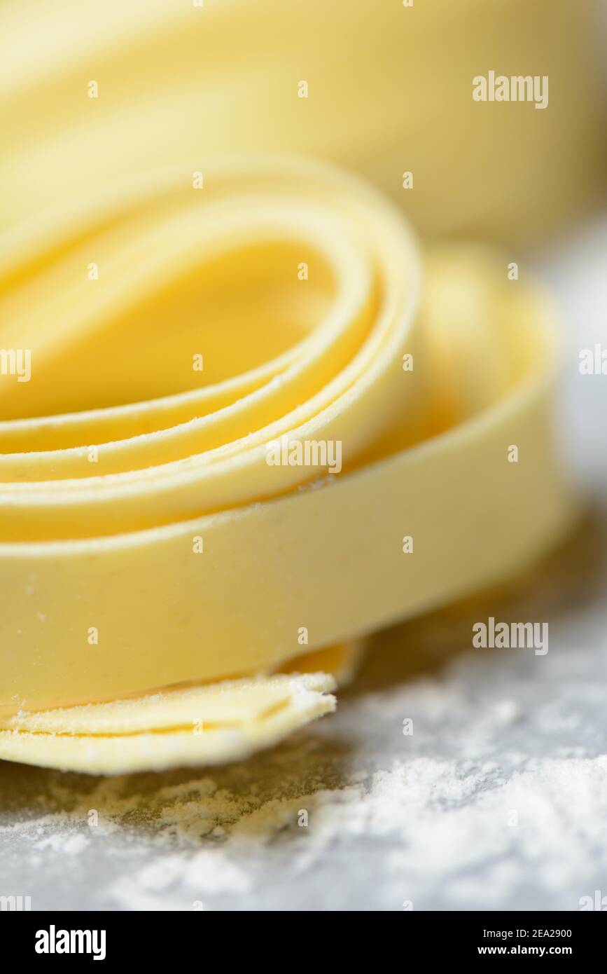 Tagliatelle, uncooked, pappardelle, pasta, ribbon noodles Stock Photo ...