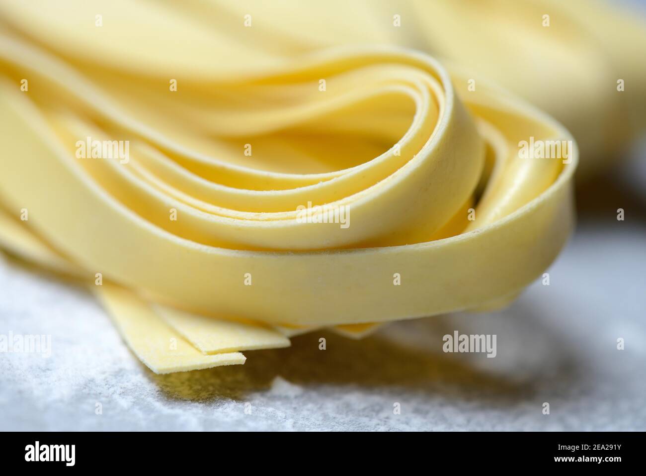 Tagliatelle, uncooked, pappardelle, pasta, ribbon noodles Stock Photo ...