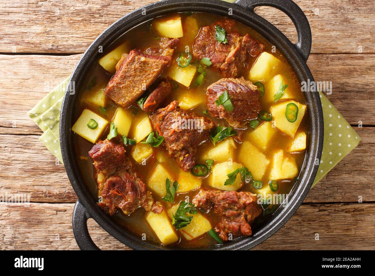 Spicy lamb with potatoes stew Aloo Gosht Pakistani cuisine closeup in ...