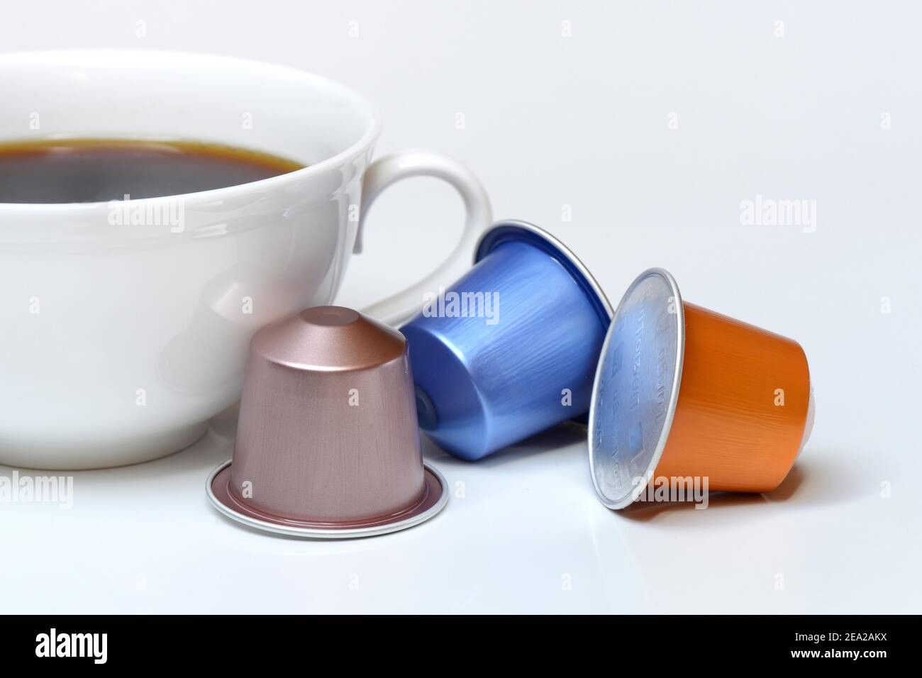 Coffee capsules and coffee cup with coffee Stock Photo - Alamy