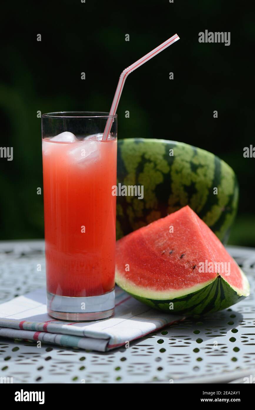 Watermelon juice in glass with drinking straw Stock Photo - Alamy