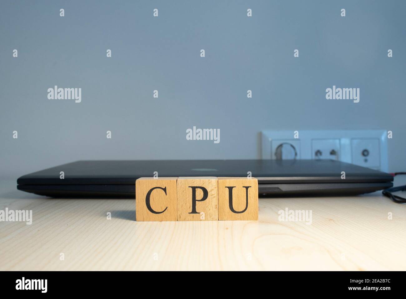 The word CPU is written. Computer and headset in the background ...