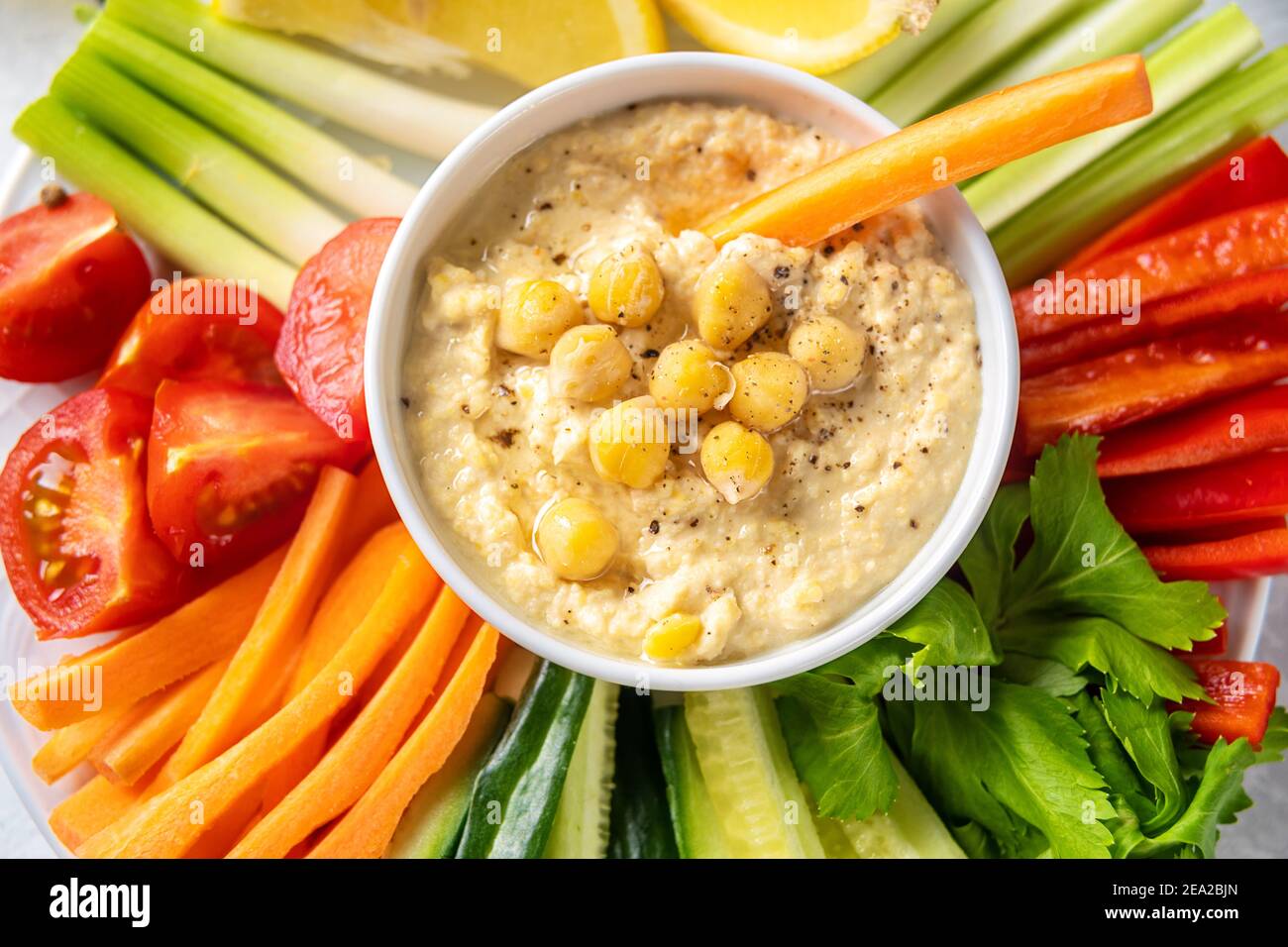 Top view of a hummus plate with vegetable sticks Stock Photo - Alamy