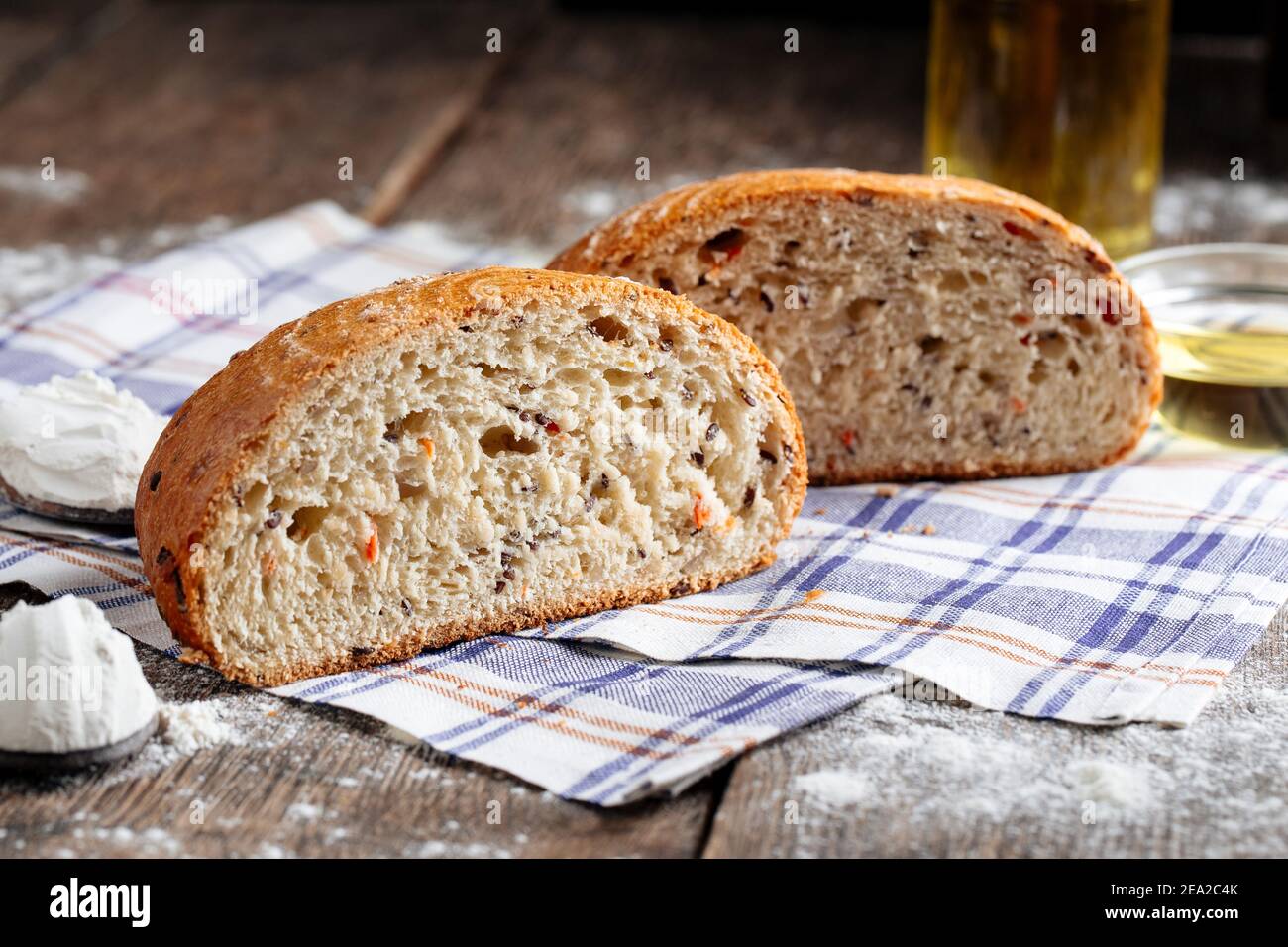 Side view on cut loaf of rustic bread with filling Stock Photo - Alamy