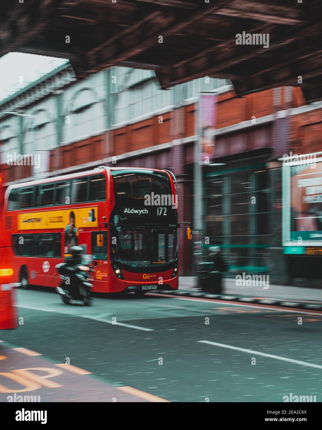 London UK January 2021 Panning shot of a popular red double decker ...
