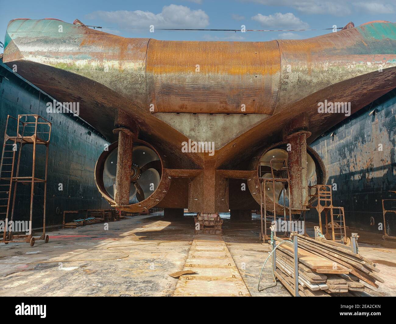 Industry view - Ocean Vessel in the dry dock in shipyard. Old rusty ...