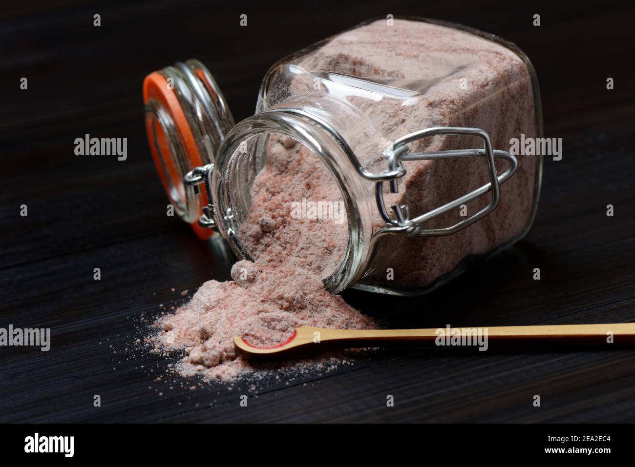 Kala Namak, ground salt in glass container and spoon, Indian salt ...