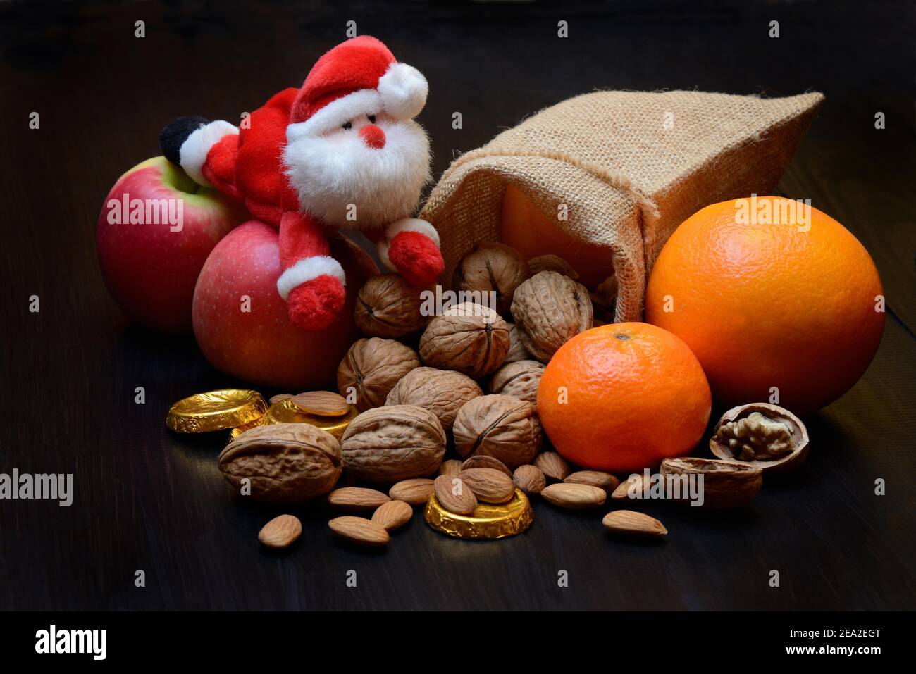 Nuts and fruits for St. Nicholas Day, almonds, apples, pears, orange ...